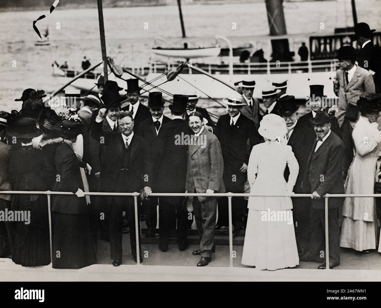 Former U.S. President Theodore Roosevelt, standing with group of people ...