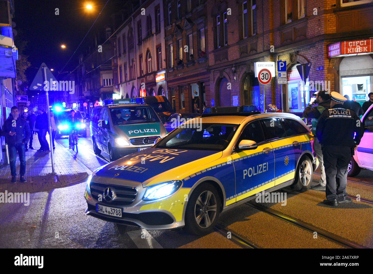 24 October 2019, Germany (German), Mannheim: Police cars are parked on ...
