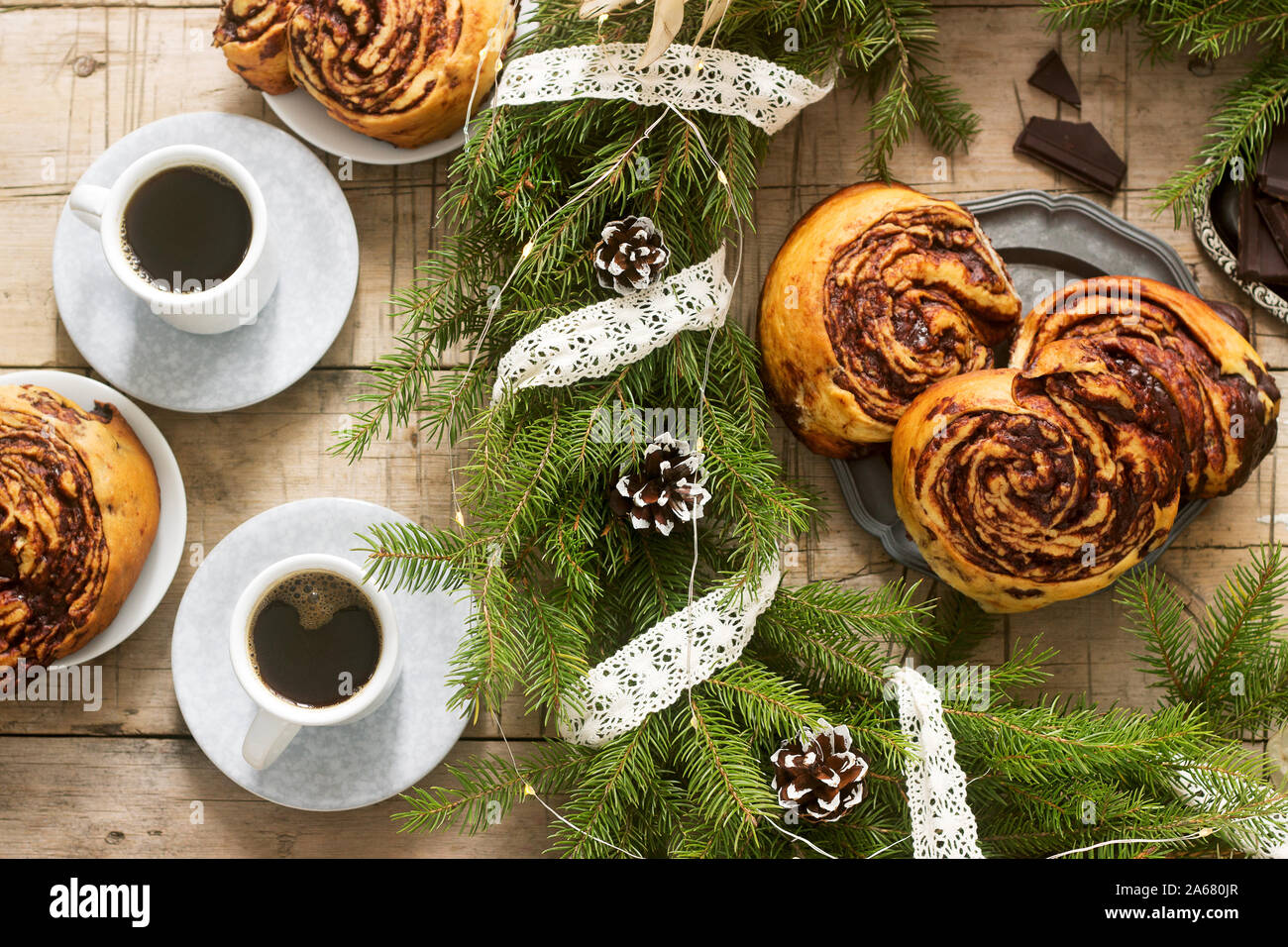 Snail chocolate muffins served with coffee on the background of a ...