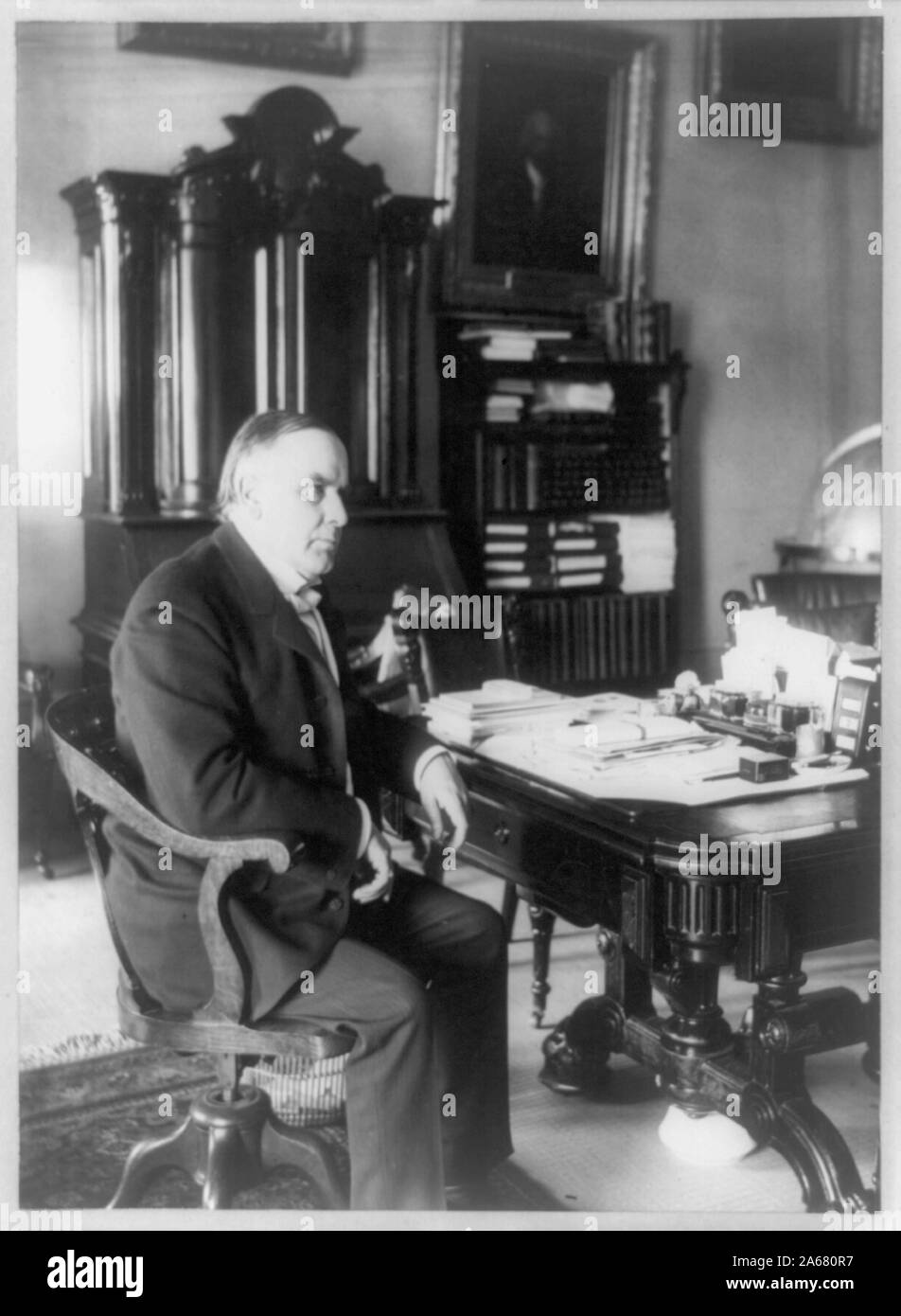 William McKinley, full-length portrait, seated at desk, facing right ...
