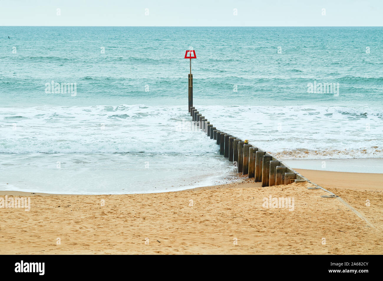 Groyne on the sandy beach of the English channel at Bournemouth ...