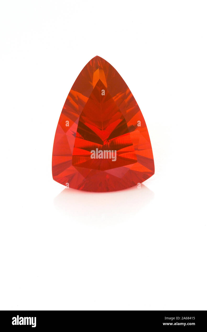 A large fantasy cut mexican fire opal shown on a white background. The ...