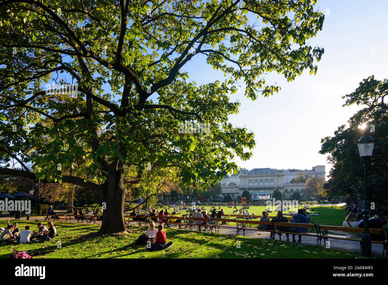 Wien, Vienna: park Stadtpark, meadow, people sunbathing, talking, tree in Austria, Wien, 01. Old ...