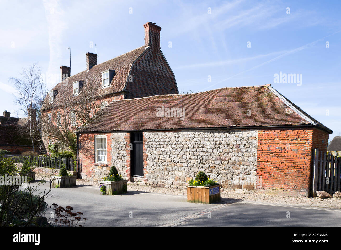 Old farmhouse and outbuildings in Avebury village in Wiltshire England ...