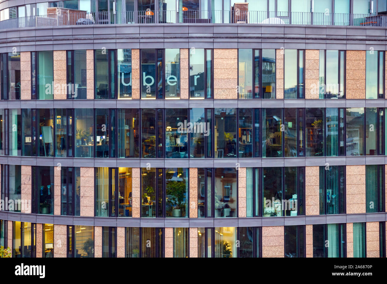 Large multi storey modern office building with large glass panels ...