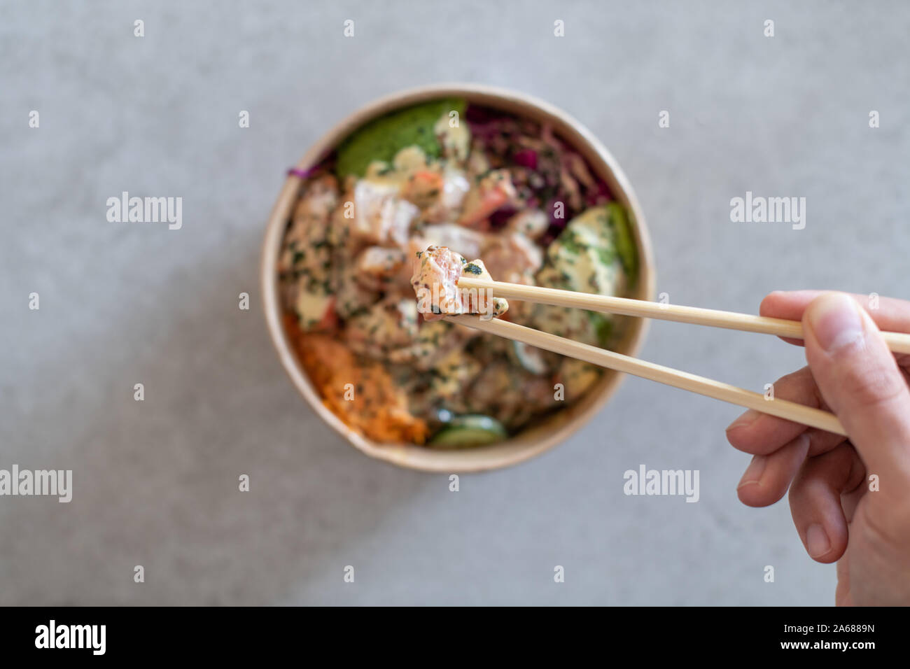 California Poke Bowl with salmon, avocado, crab surimi, carrot, red ...