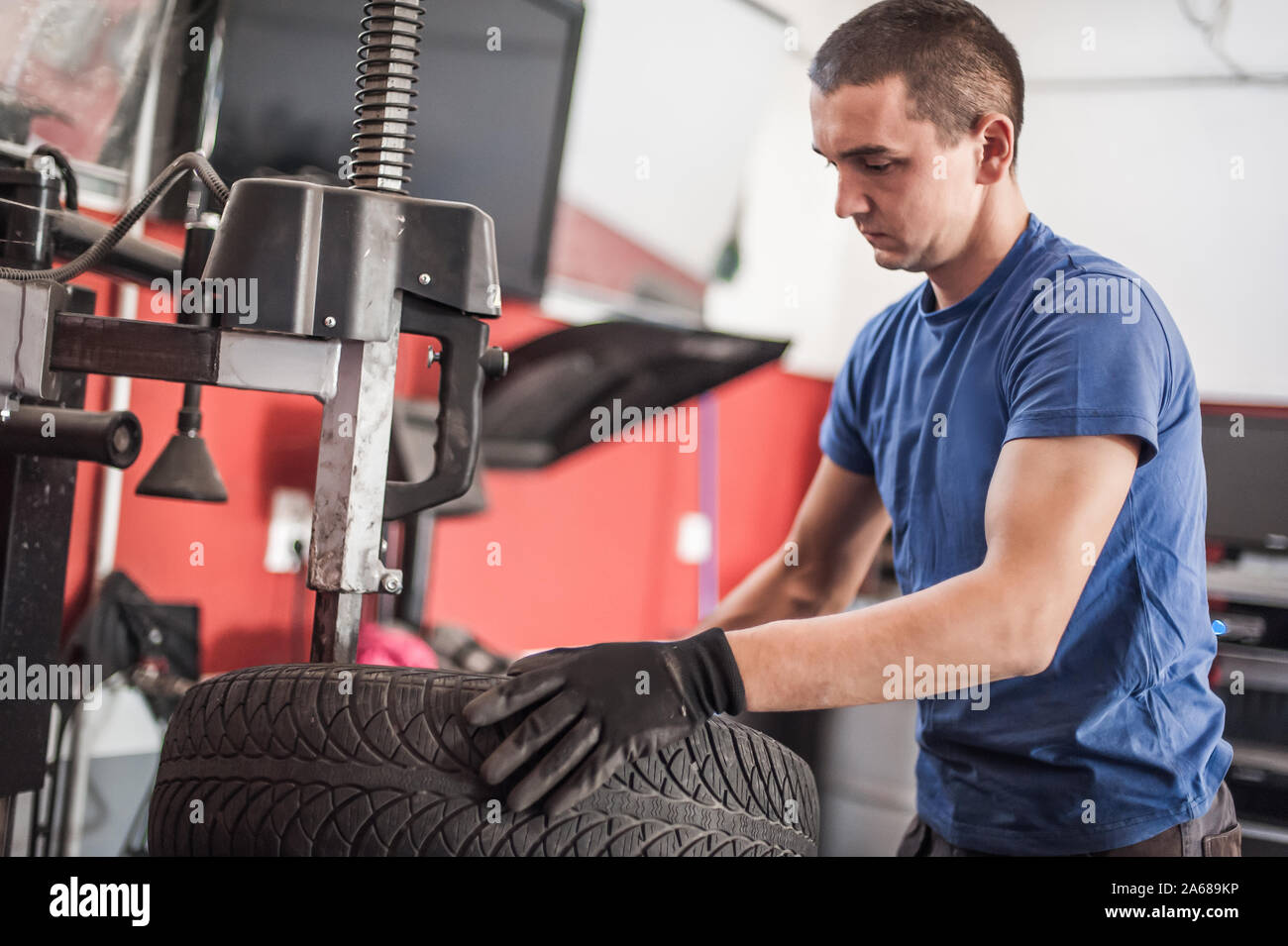 Car master mechanic vulcanizer repairing tire on automatic rubber repair vulcanizer machine in ...