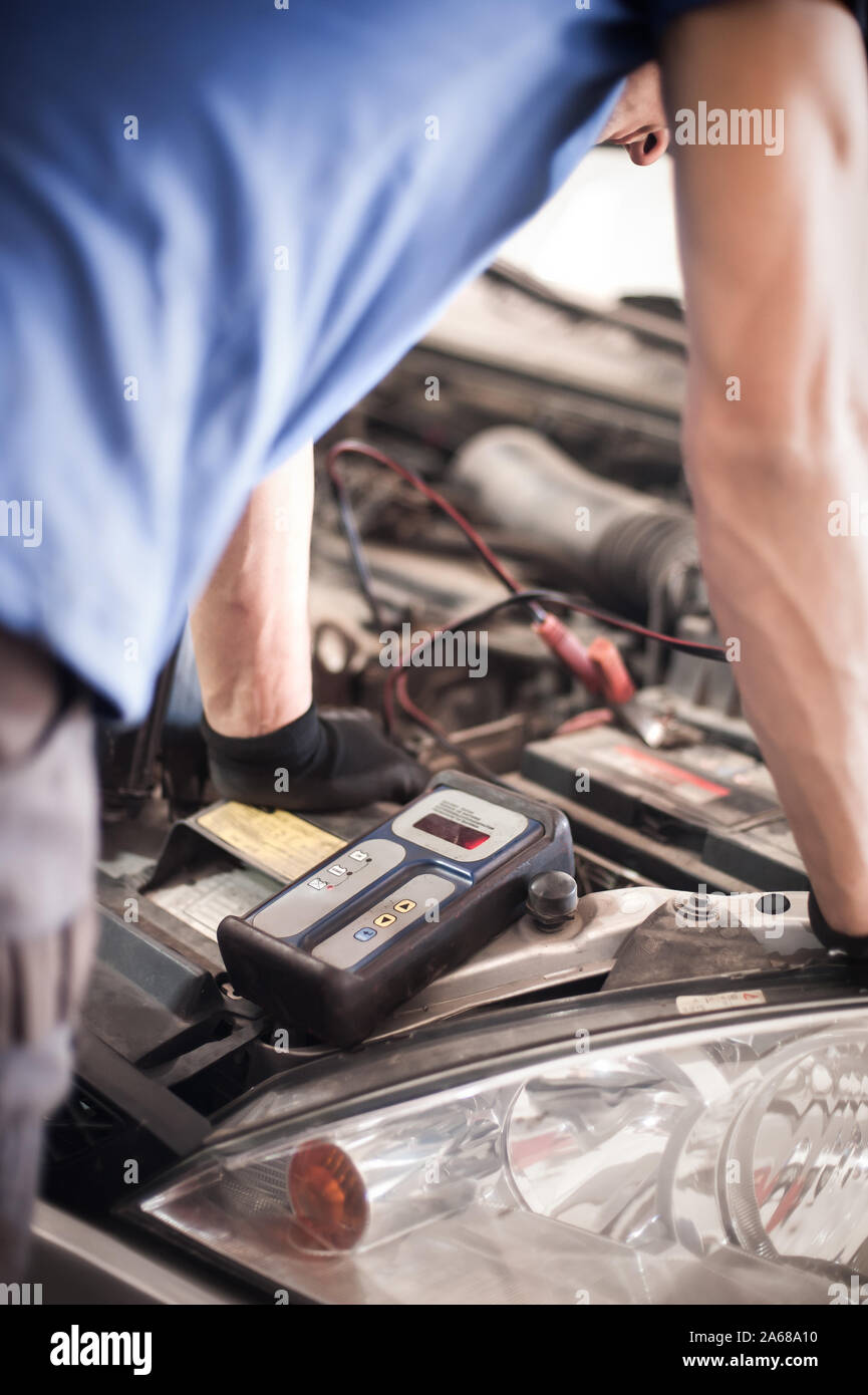 Car master mechanic repairer checking and testing automotive ...