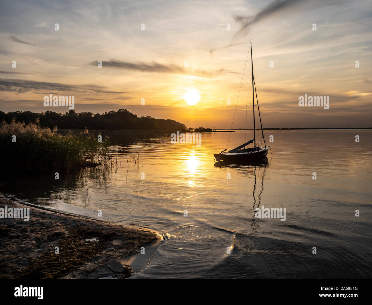 Sunset at lake Mueritz, beach of village Rechlin, Mueritz National Park ...
