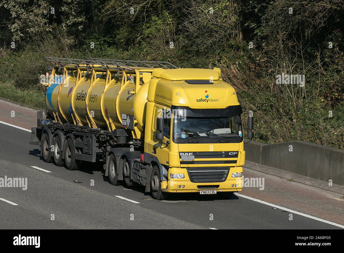 A Safety Kleen transport tanker articulated DAF semi truck traveling on ...
