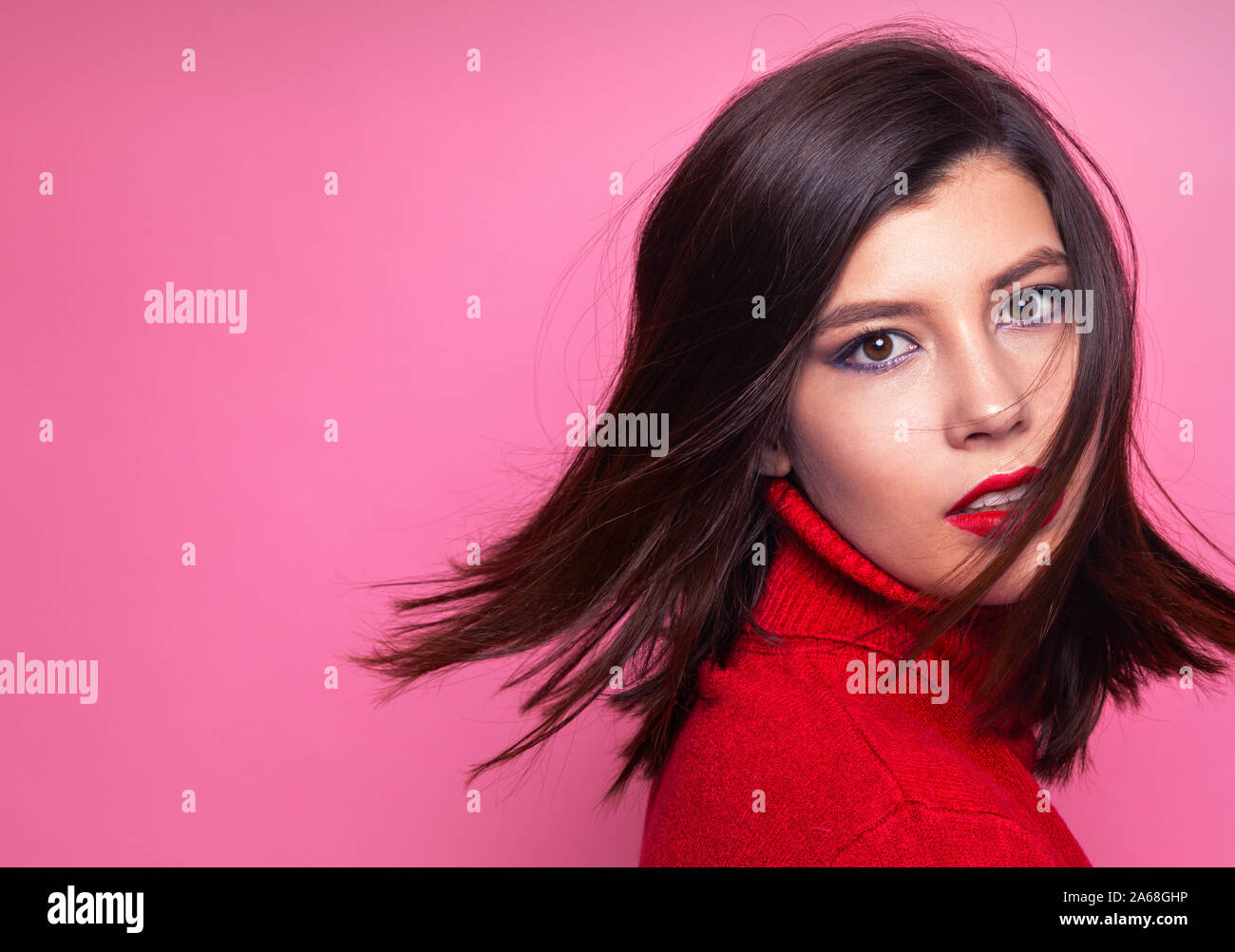 portrait of a girl looking back in the Studio Stock Photo - Alamy