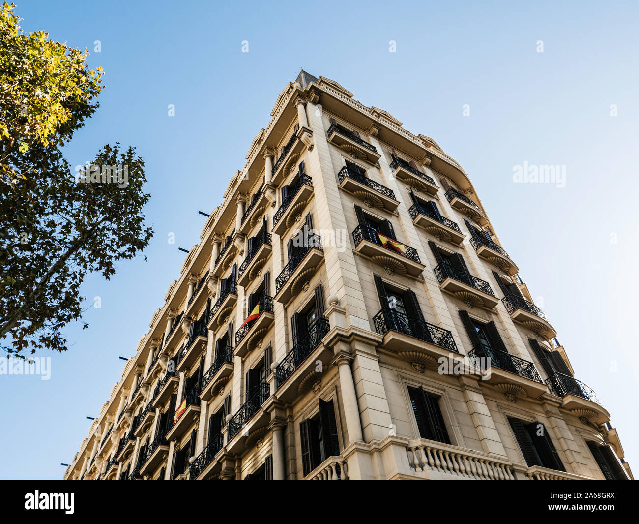 Low angle view of beautiful catalan architecture with clear blue sky in ...