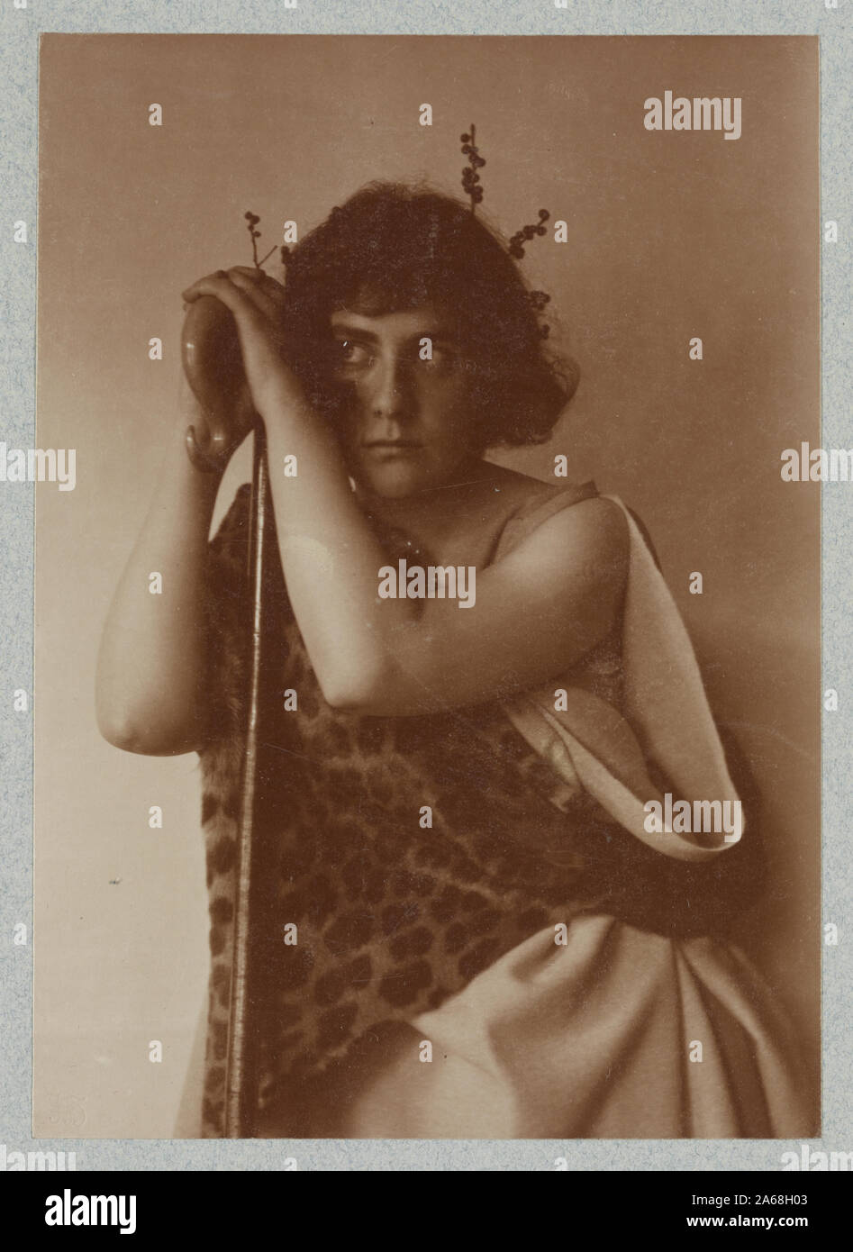 Woman (Ethel Reed) in nymph costume as Chloe with leopard skin, berry ...
