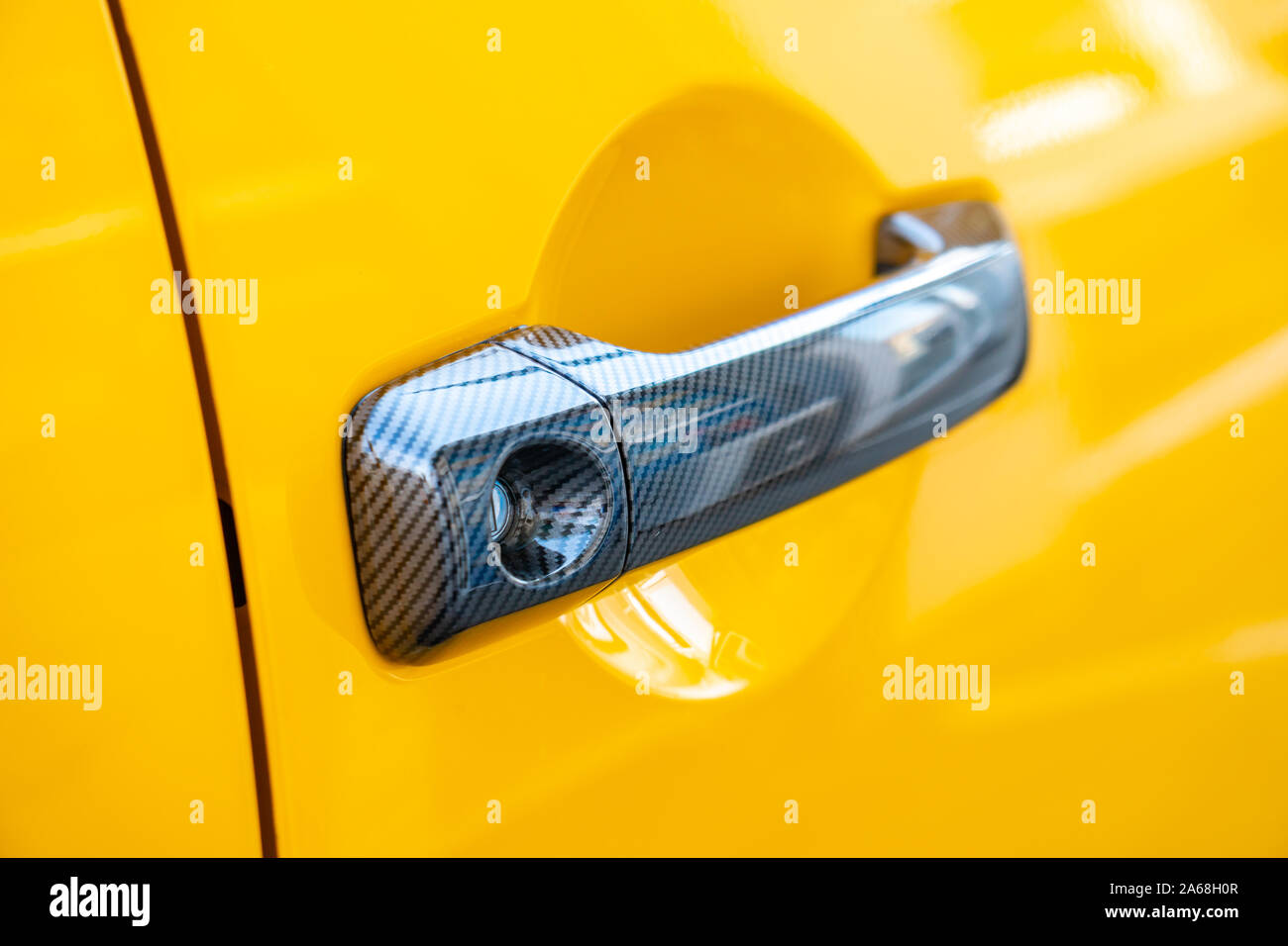 Car Door Lock and Handle. Yellow color. Transportation Stock Photo - Alamy