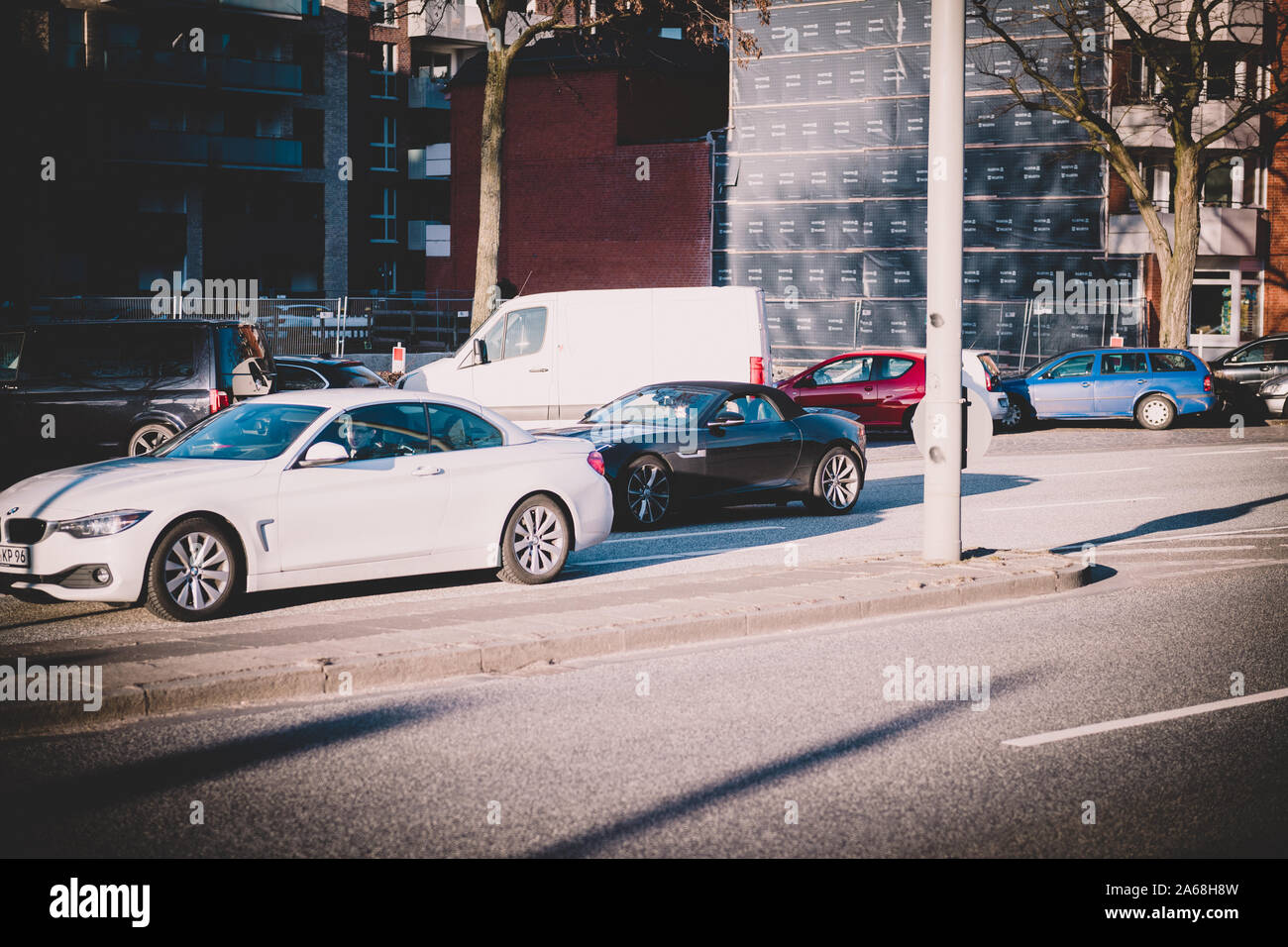 Hamburg, Germany - Mar 2018: White BMW and black Jaguar coupe car ...