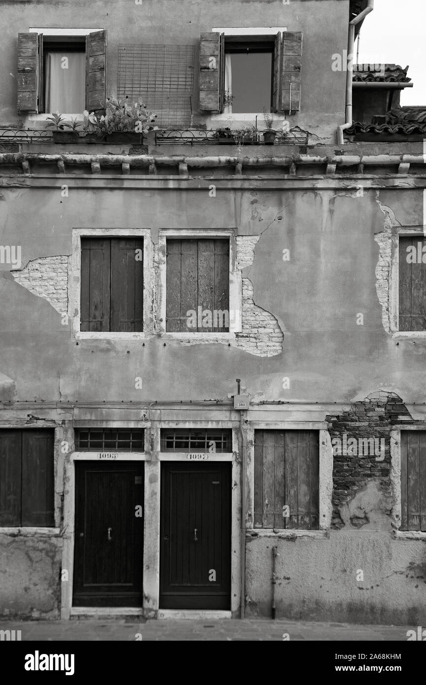 Campo Nazario Sauro: two doors and shuttered windows in a dilapidated ...