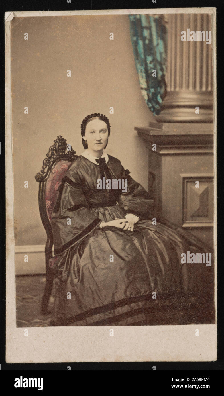 Woman, seated in chair, facing right Stock Photo - Alamy