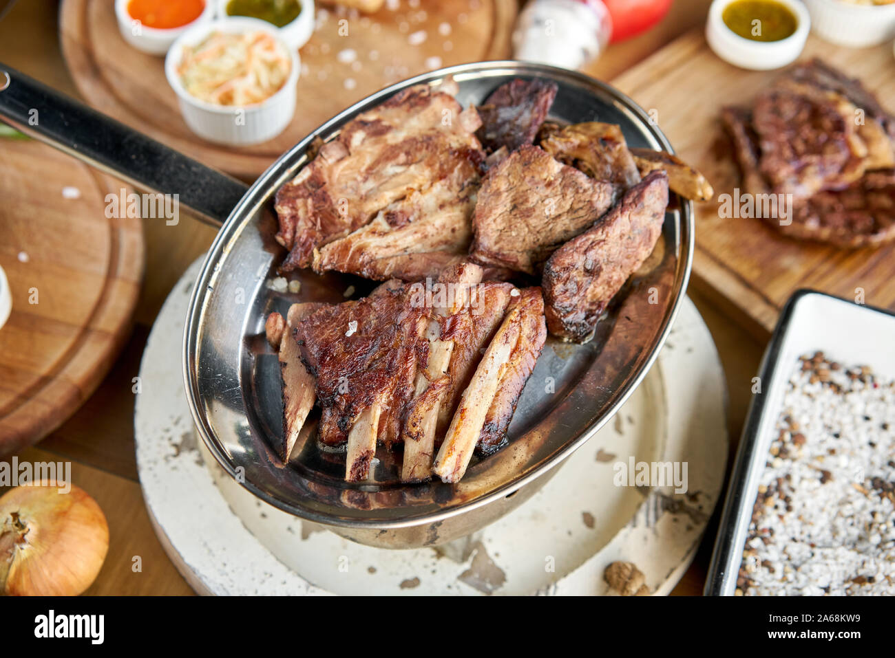Various grilled meat set heated on coals. Barbecue restaurant menu ...