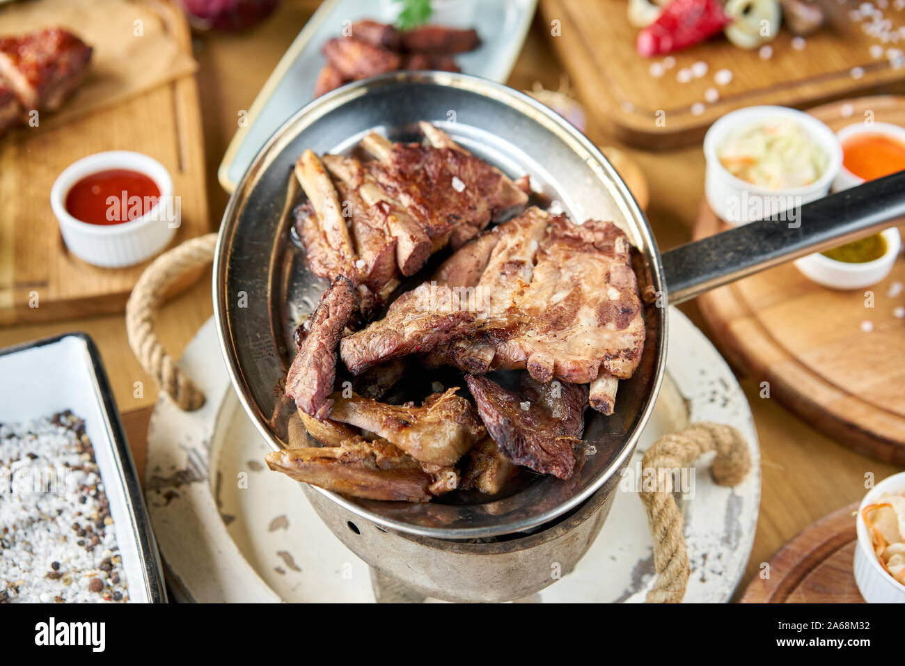 Various grilled meat set heated on coals. Barbecue restaurant menu ...