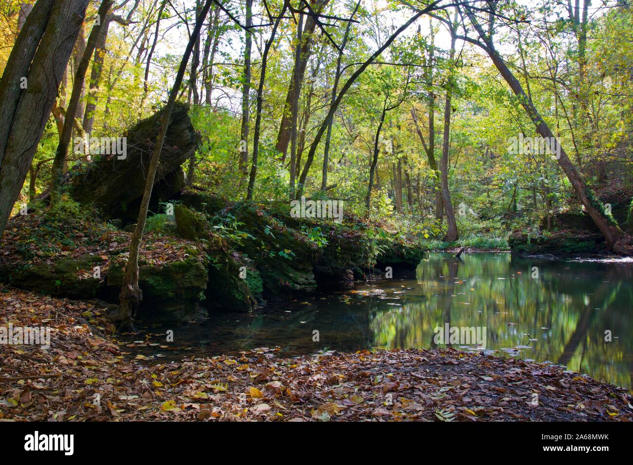 Unique rock formation by a peaceful stream in the fall in ohio. Long ...