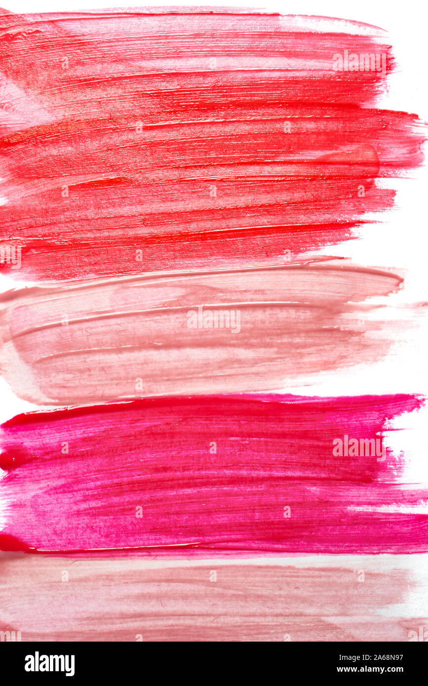 Texture of different lipsticks in fashionable shades or strokes of ...