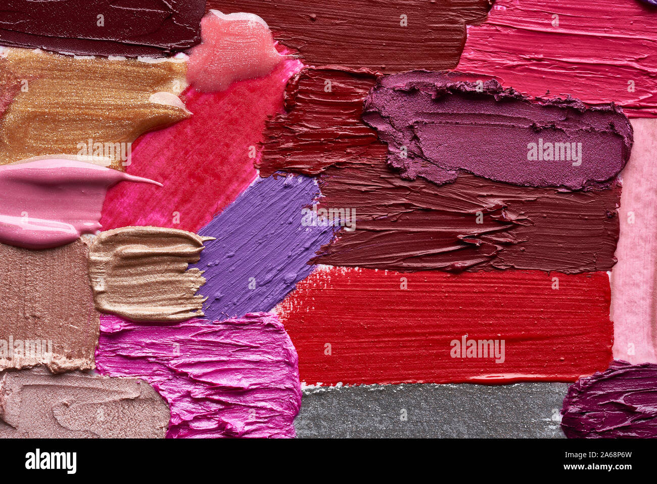 Texture of different lipsticks in fashionable shades or strokes of ...