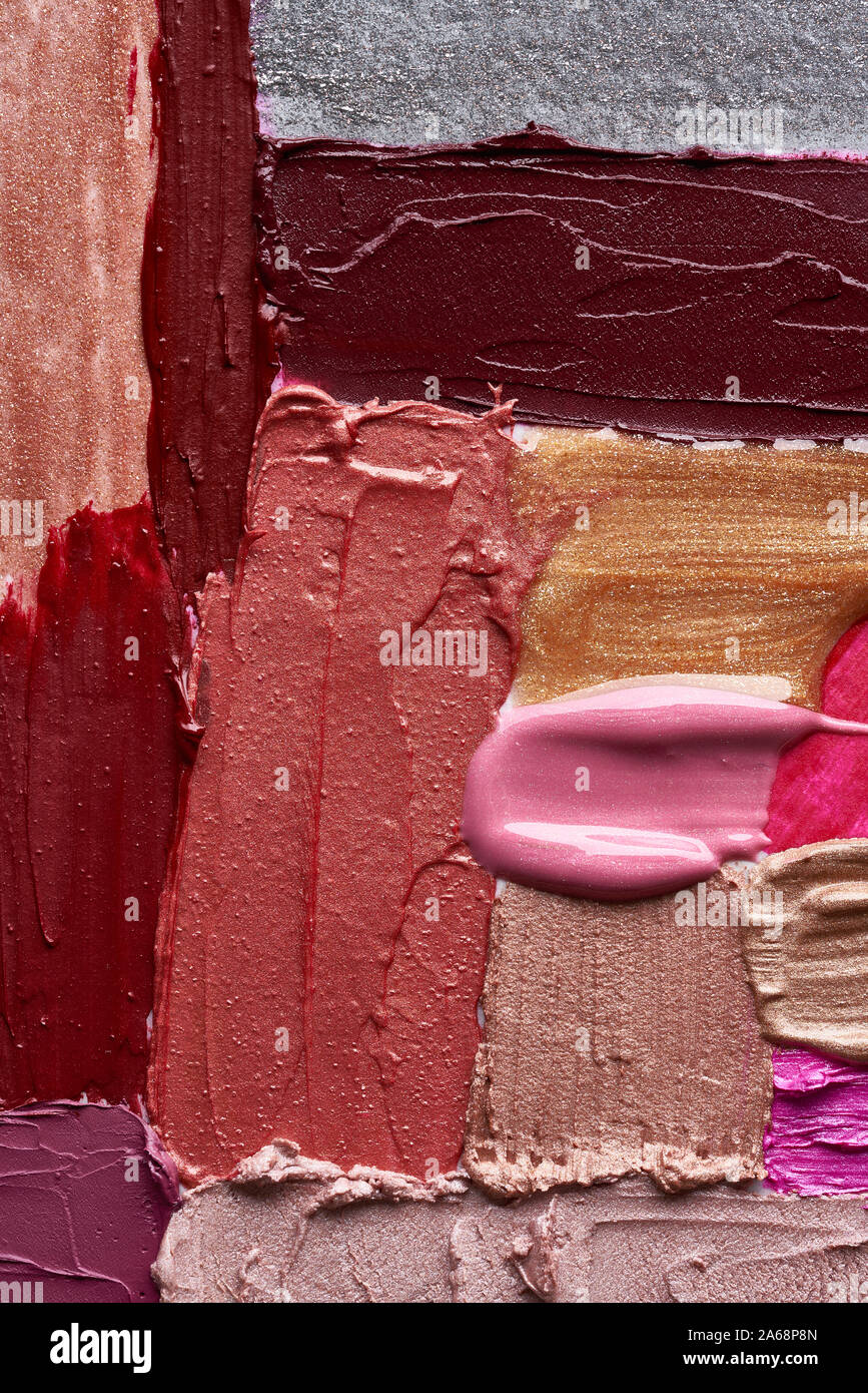 Texture of different lipsticks in fashionable shades or strokes of ...