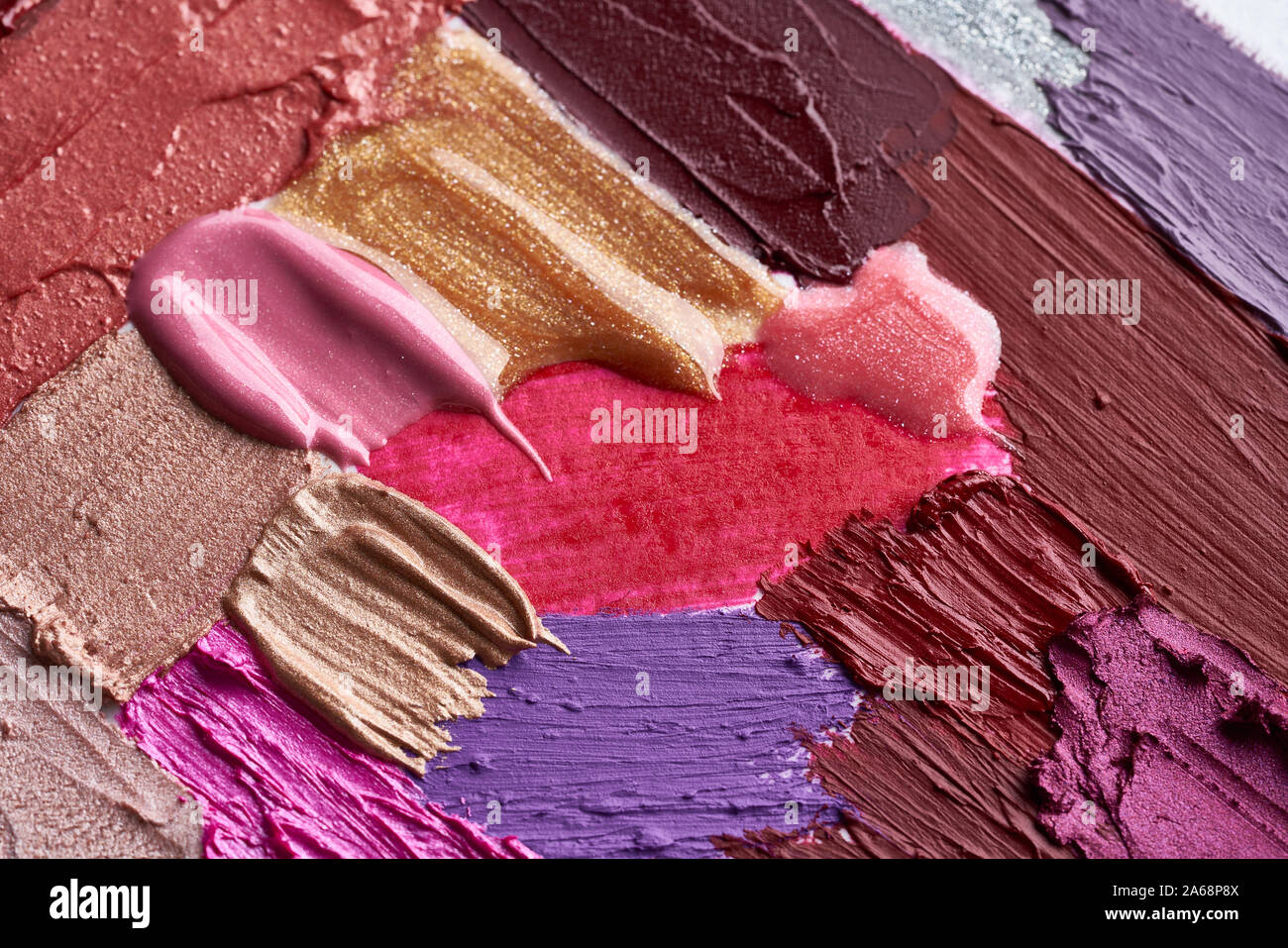 Texture of different lipsticks in fashionable shades or strokes of ...