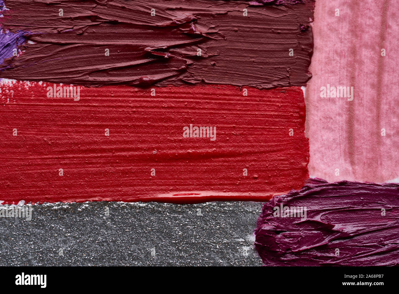 Texture of different lipsticks in fashionable shades or strokes of ...