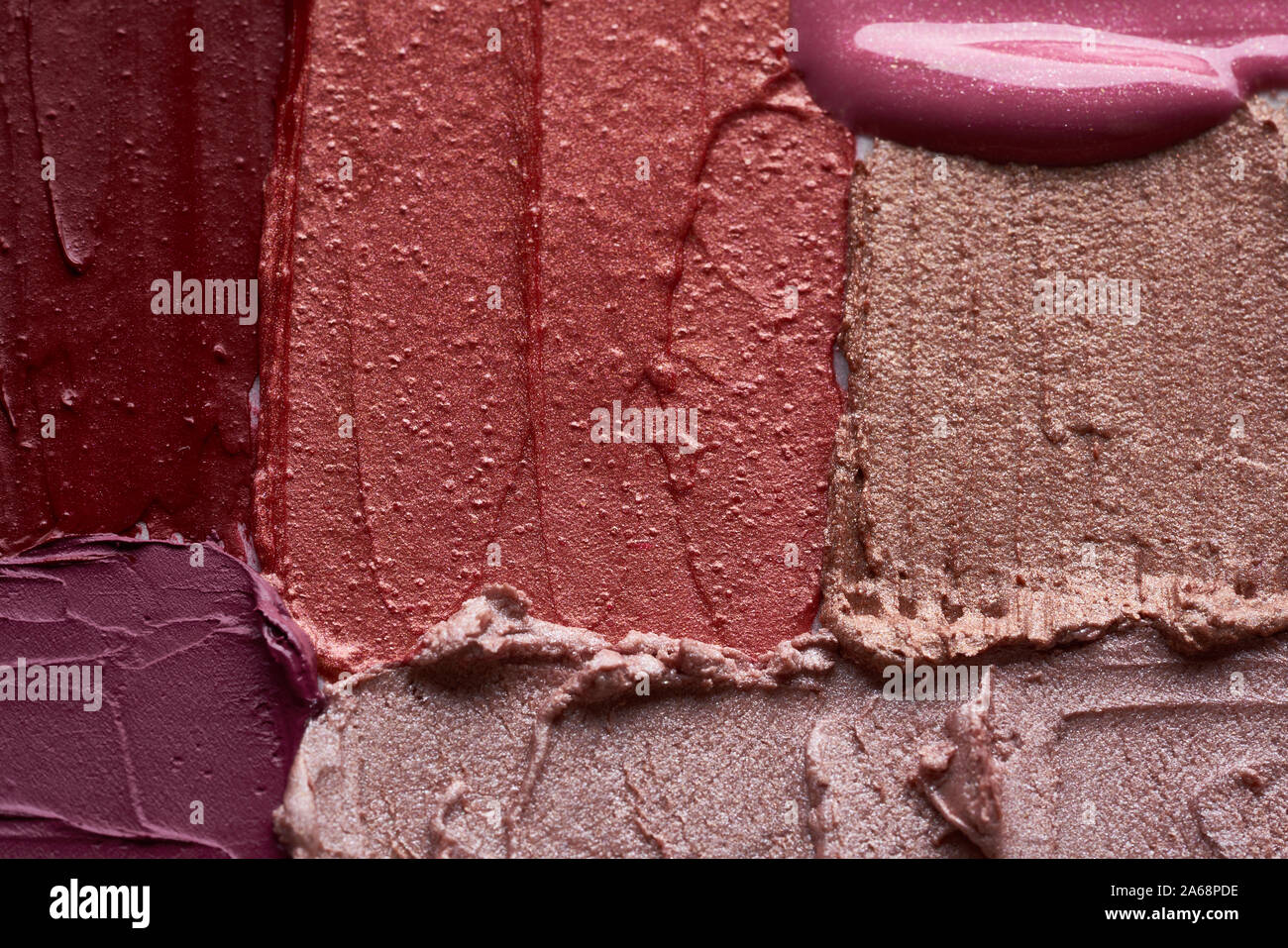 Texture of different lipsticks in fashionable shades or strokes of ...