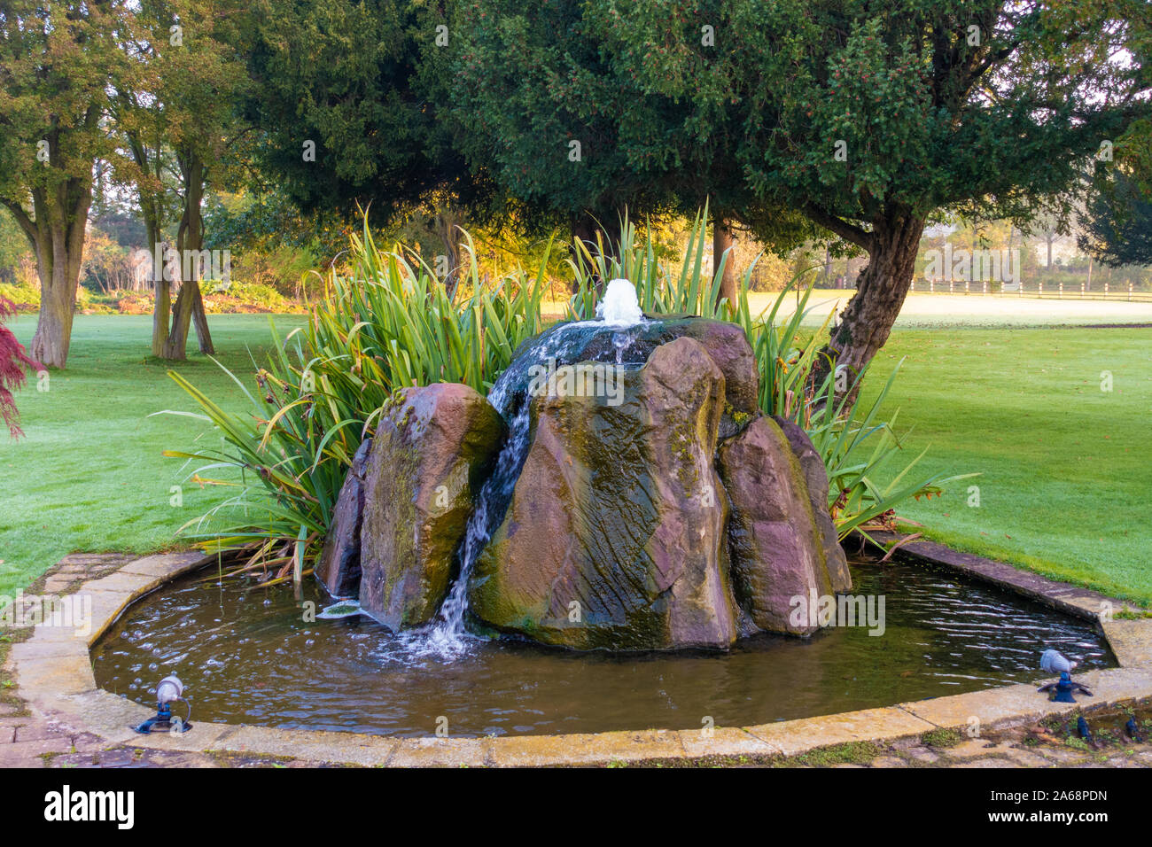 Natural rock water feature fountain Stock Photo - Alamy