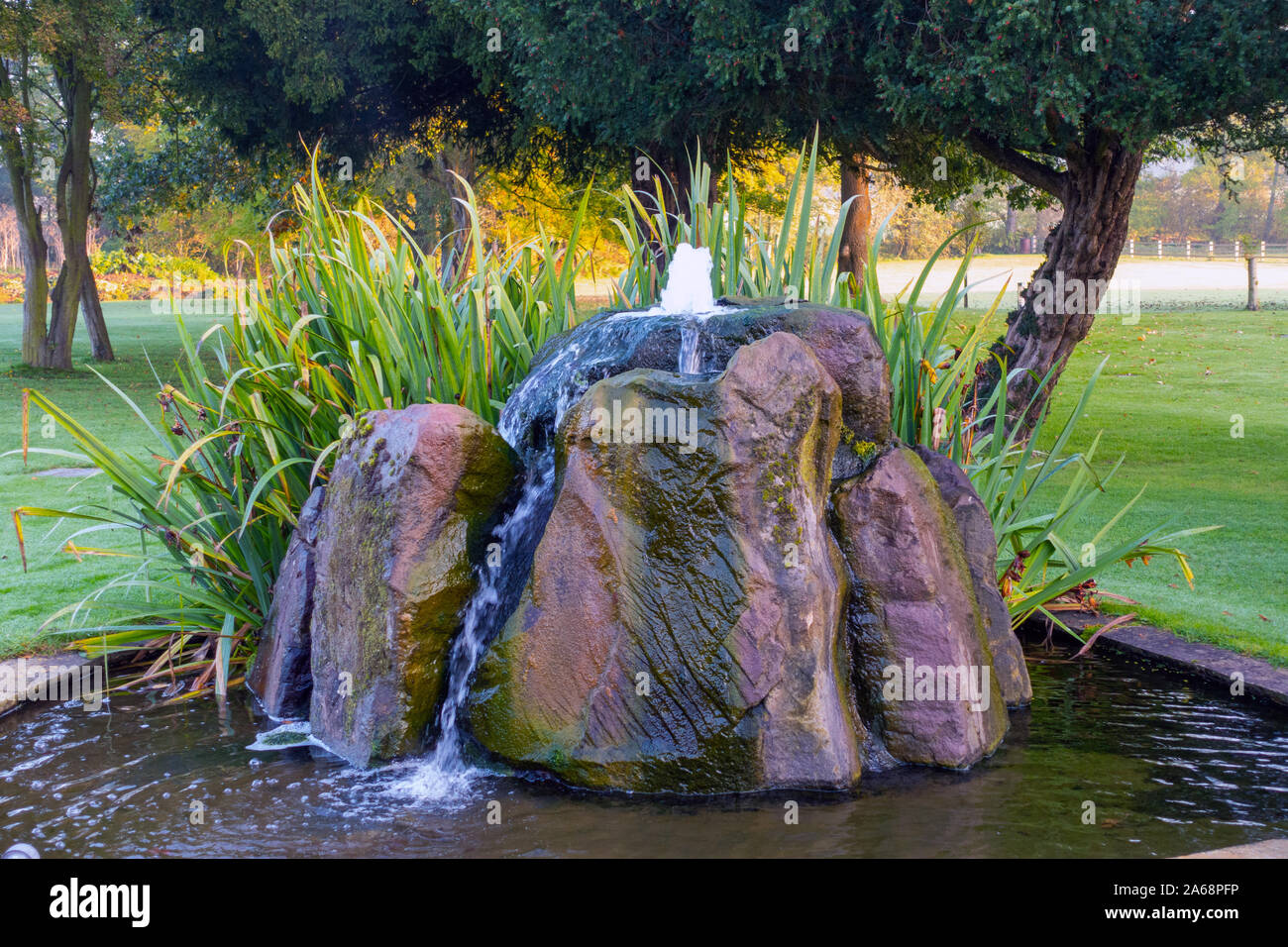 Natural rock water feature fountain Stock Photo - Alamy