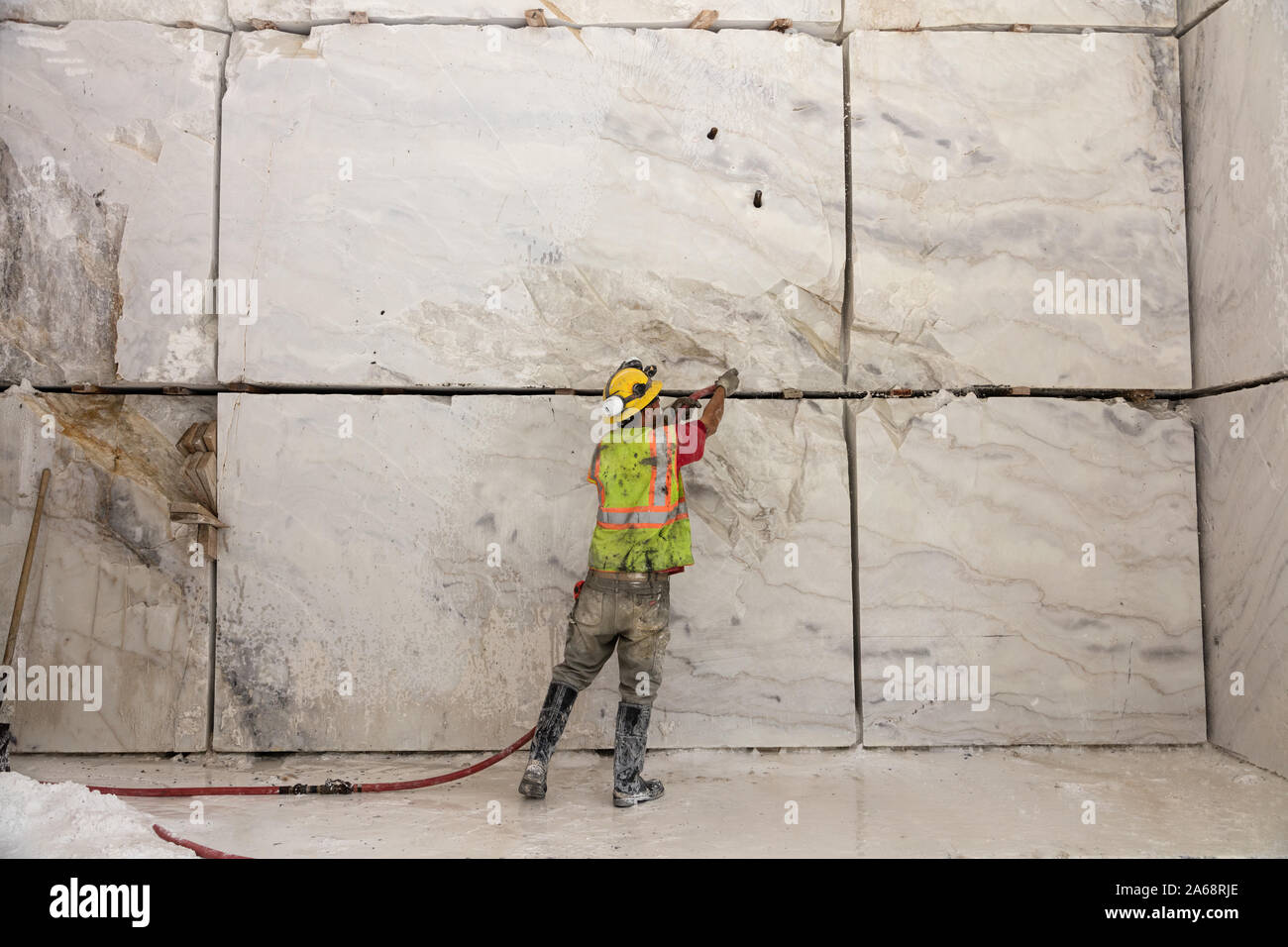 Work progresses inside the Colorado Stone Quarries mine high above the ...