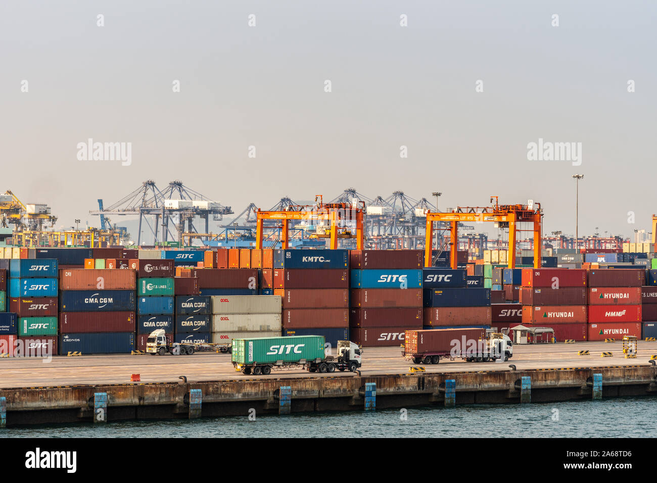 Container stacks trucks cranes seaport hi-res stock photography and ...