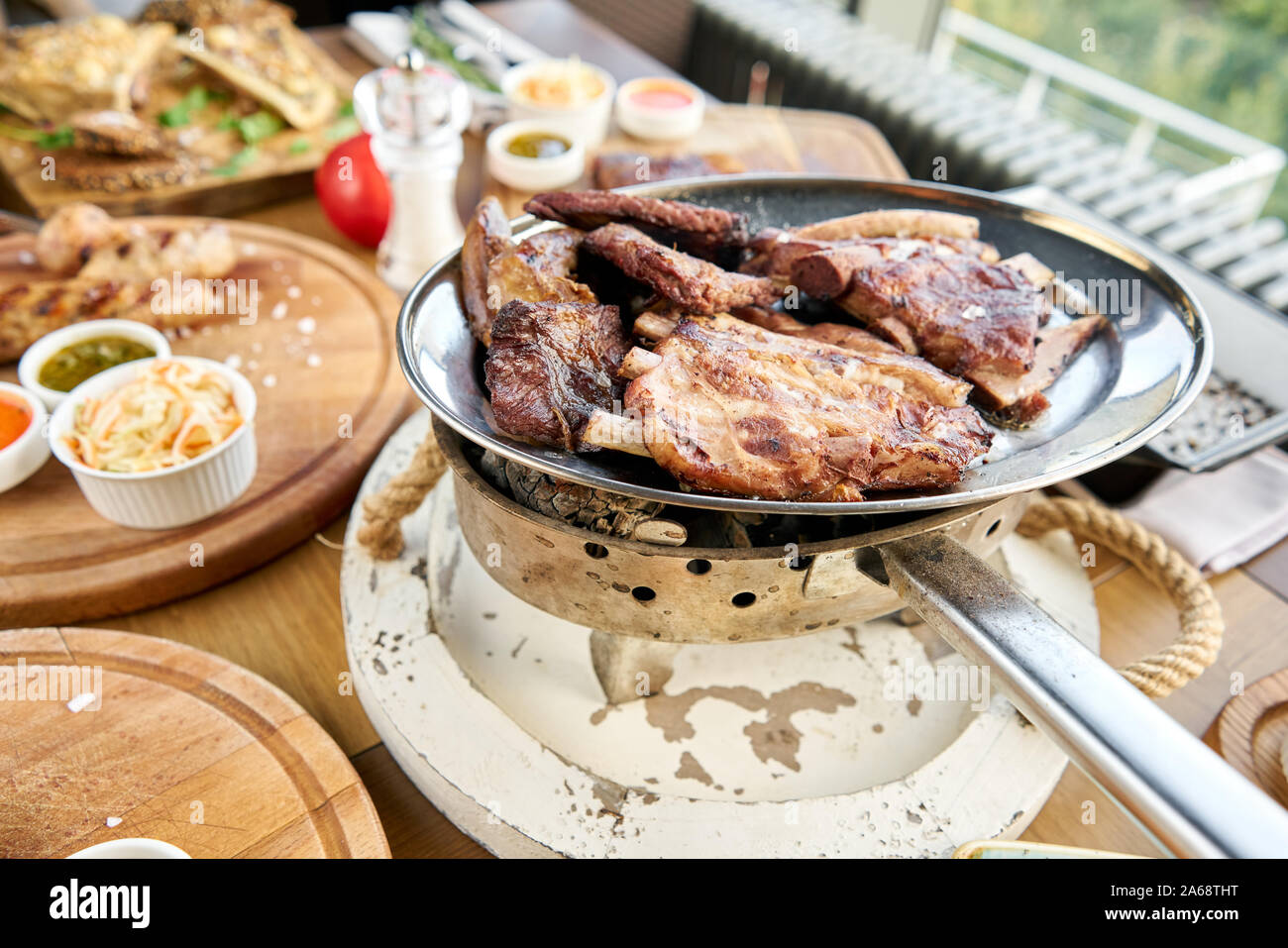 Various grilled meat set heated on coals. Barbecue restaurant menu ...