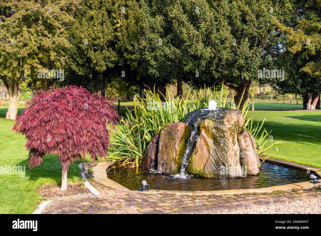 Natural rock water feature fountain Stock Photo - Alamy