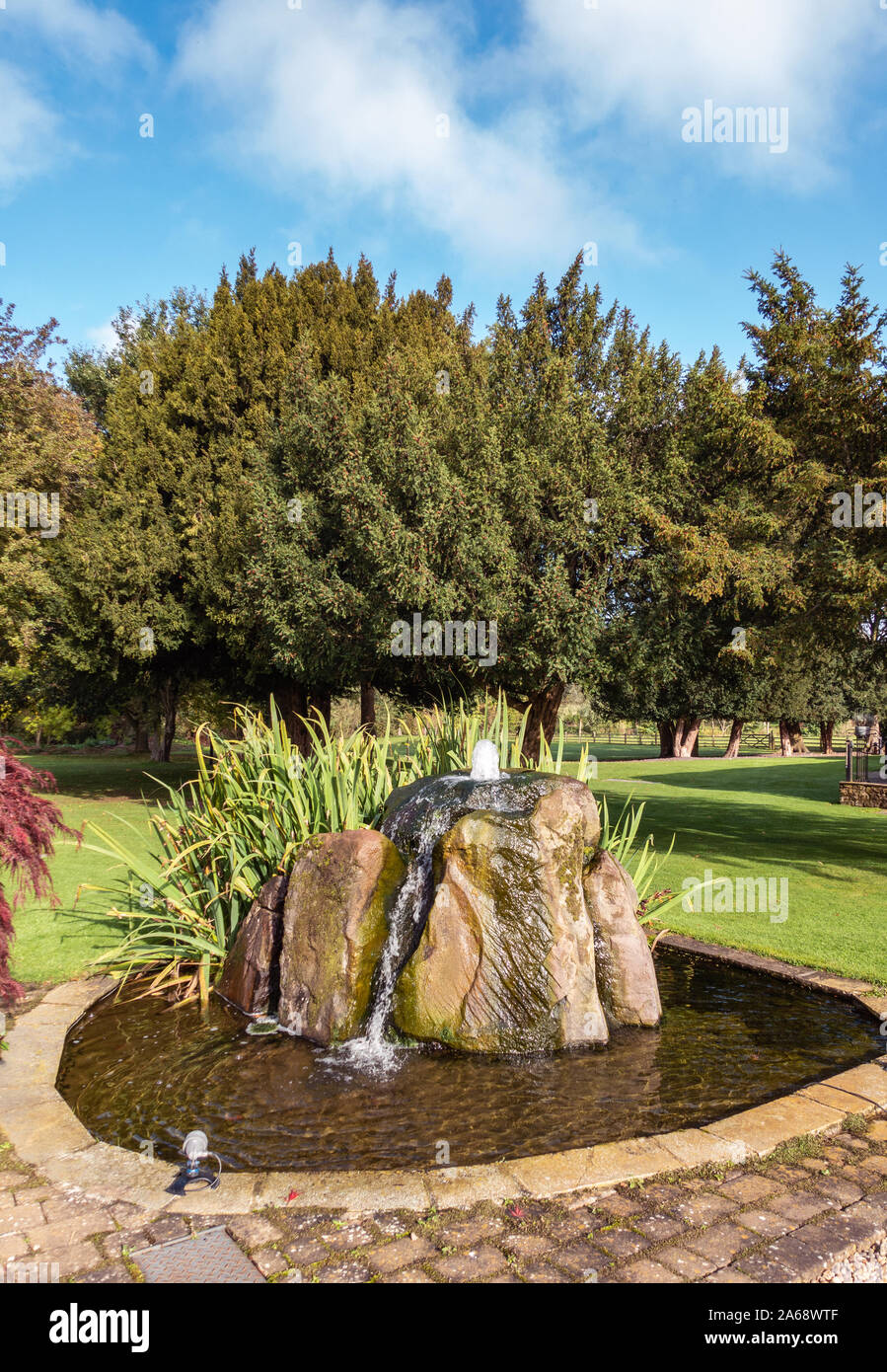 Natural rock water feature fountain Stock Photo - Alamy