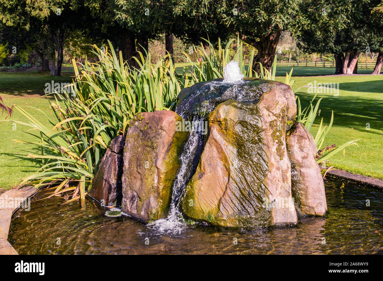 Natural rock water feature fountain Stock Photo - Alamy