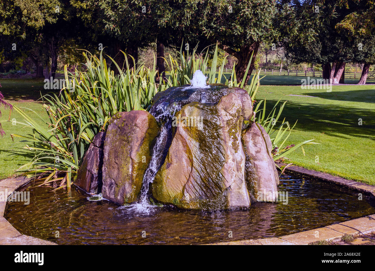 Natural rock water feature fountain Stock Photo - Alamy