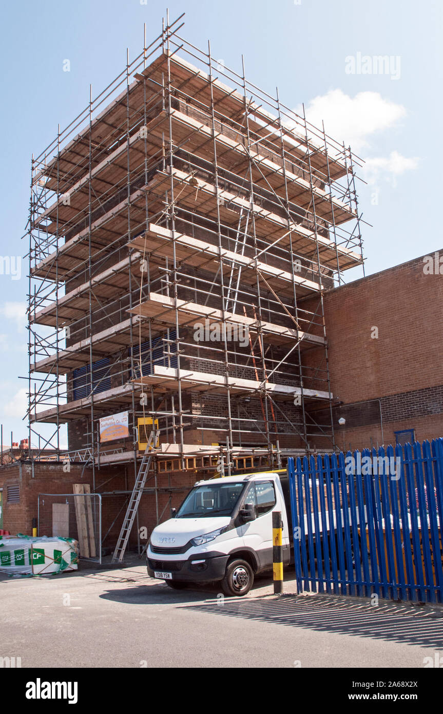 Scaffolding around building that is being refurbished Stock Photo - Alamy