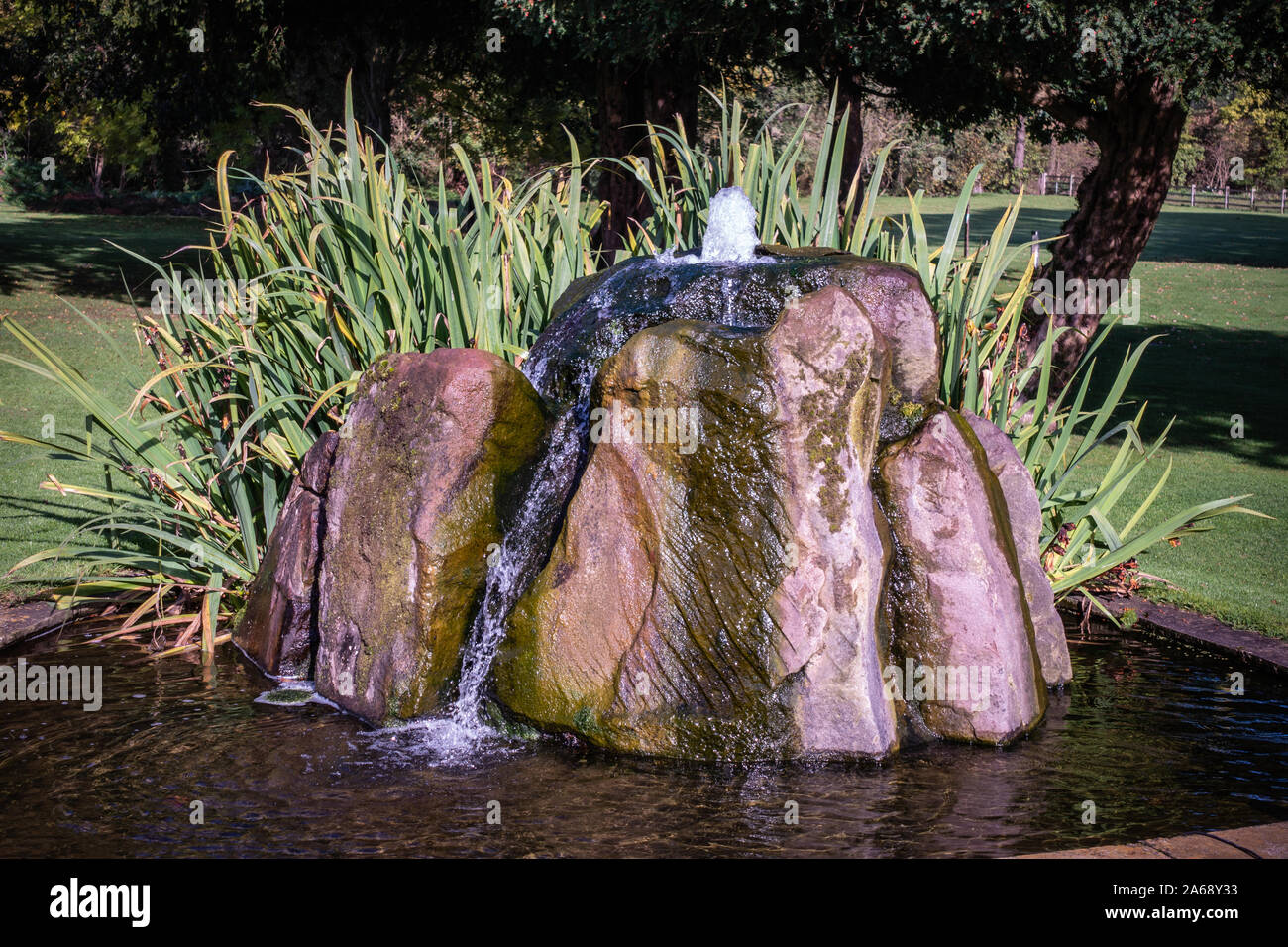 Natural rock water feature fountain Stock Photo - Alamy