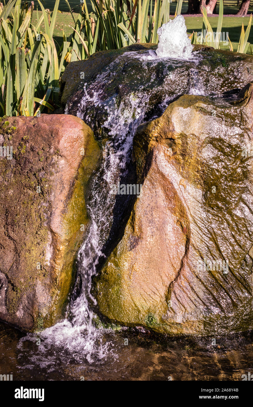 Natural rock water feature fountain Stock Photo - Alamy