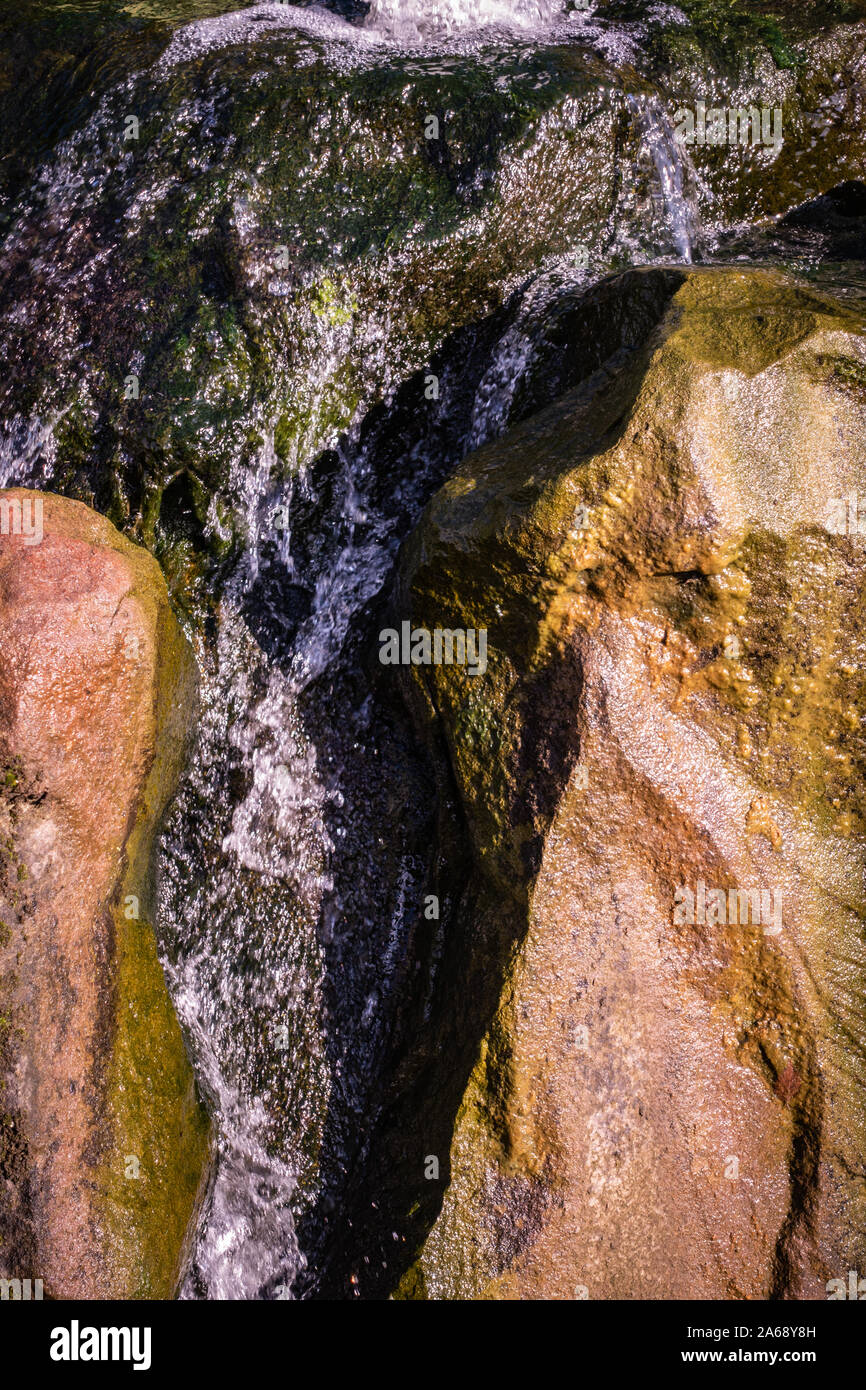 Natural rock water feature fountain Stock Photo - Alamy