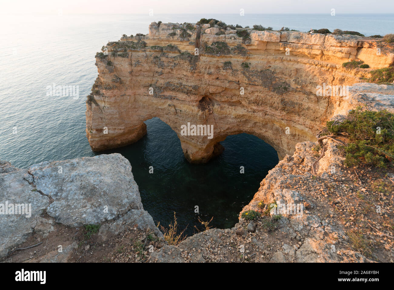 Portuguese coast line with heart shape cliff in Algarve during the ...