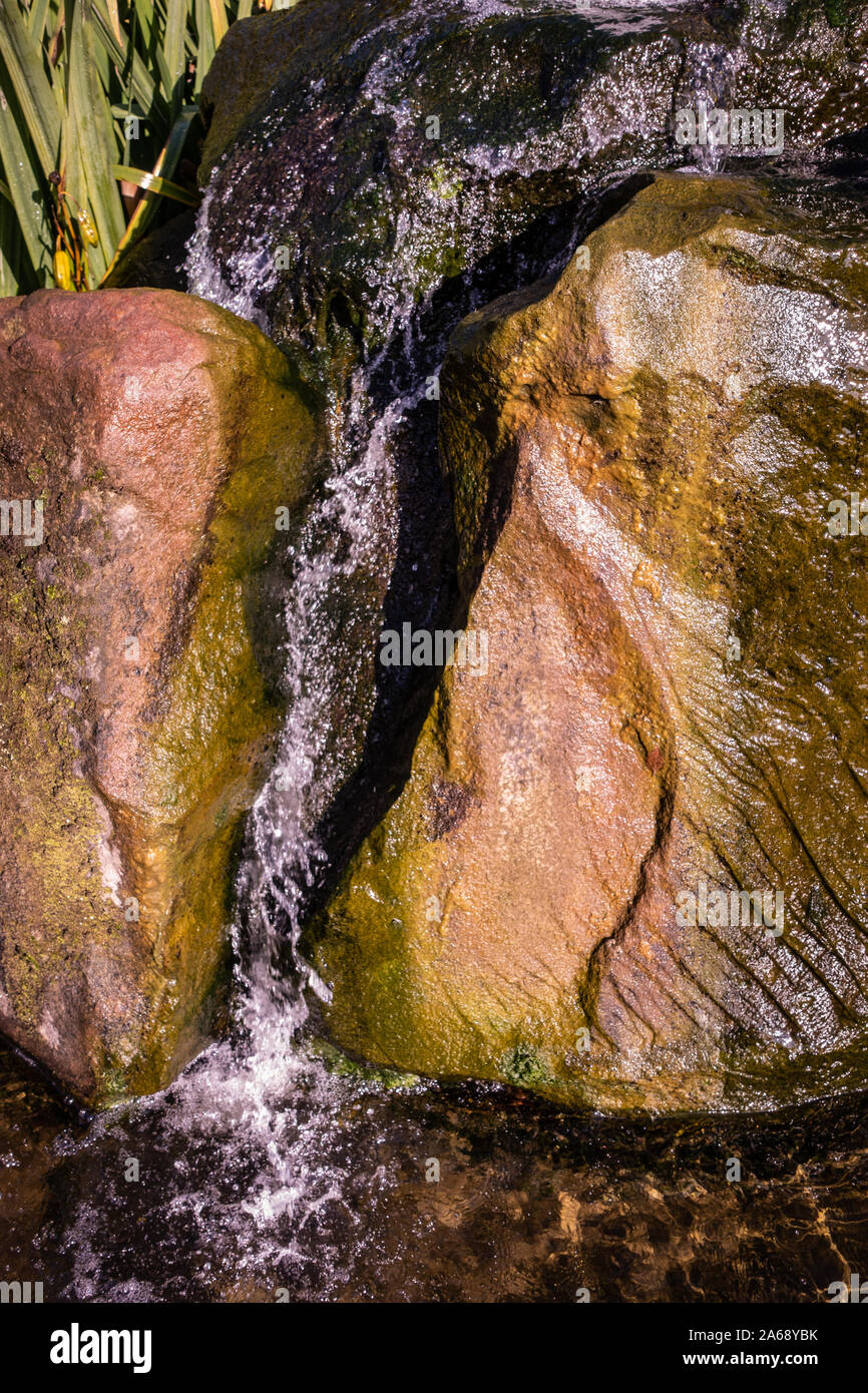 Natural rock water feature fountain Stock Photo - Alamy