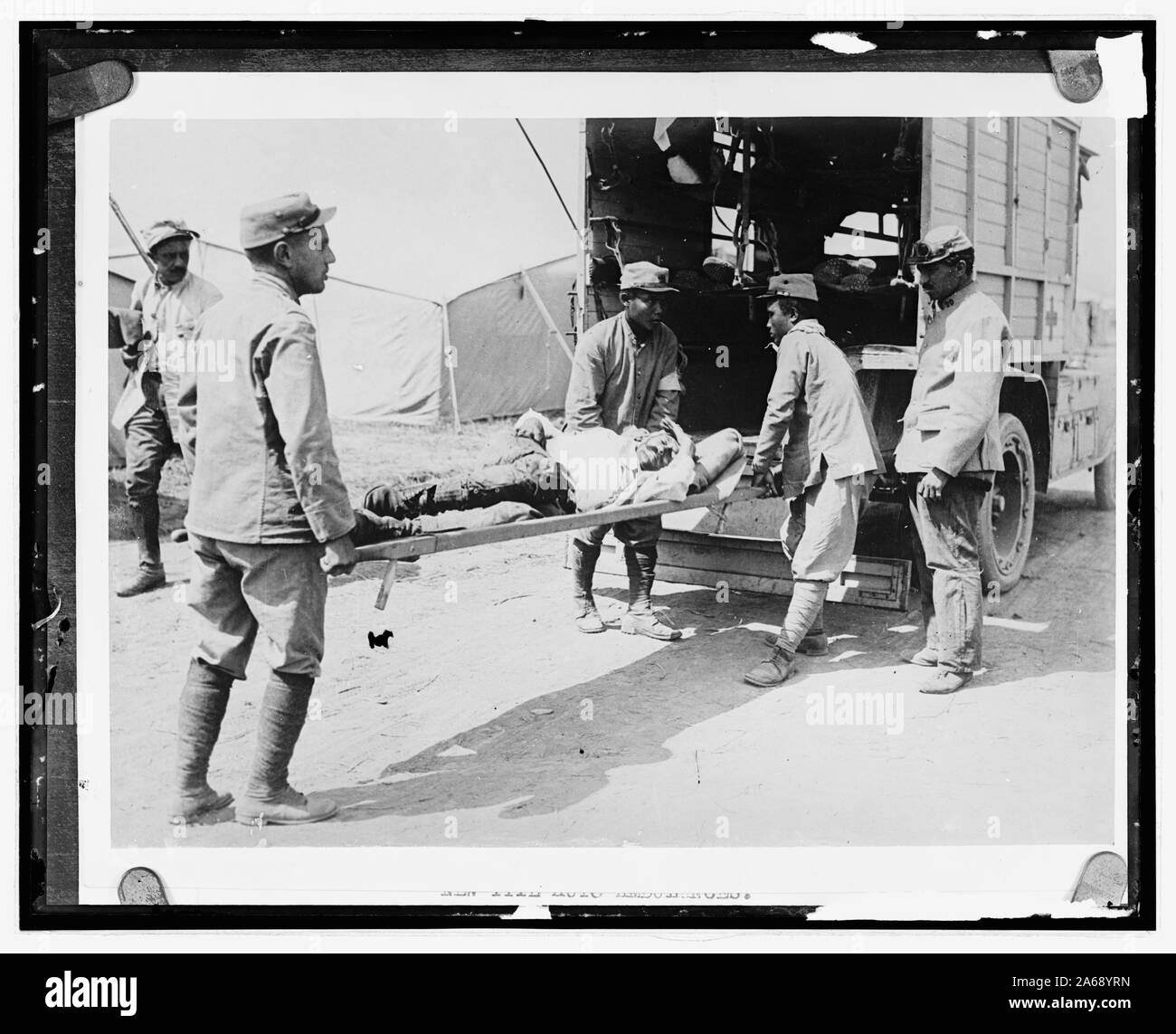 Wounded man on ambulance stretcher Stock Photo - Alamy
