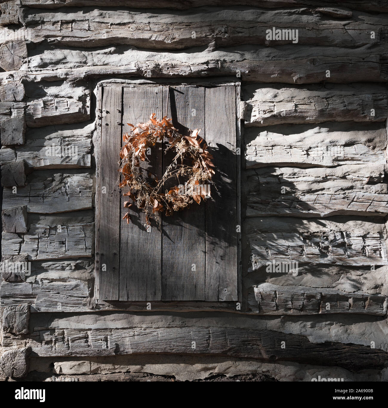 Wreath on the shutters of the Pickard Cabin at Log Cabin Village, a ...
