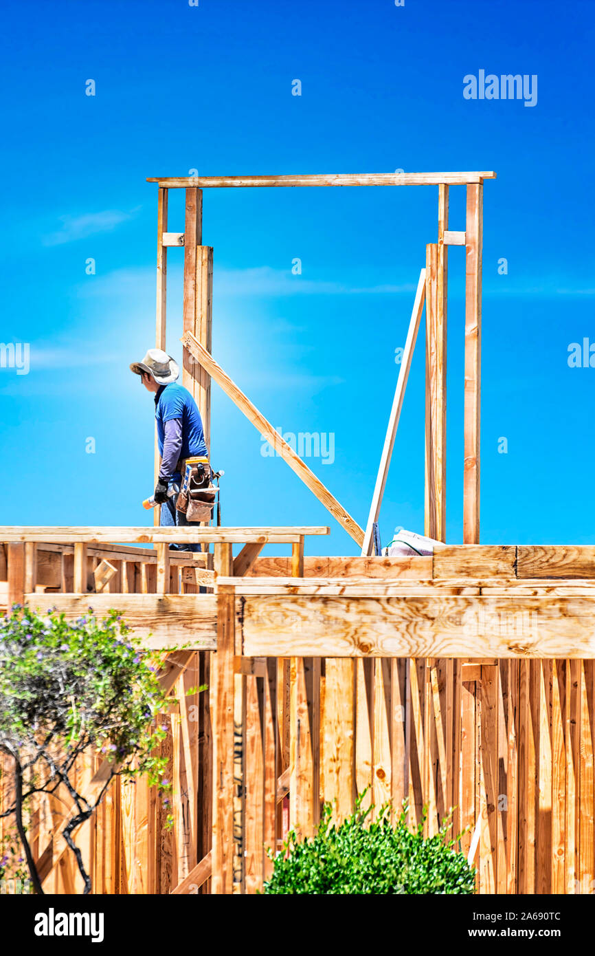 Construction worker building a two story residential house Stock Photo ...