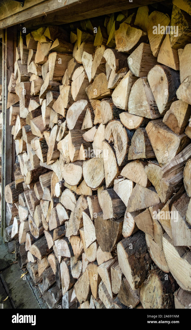 Firewood piled in shed hi-res stock photography and images - Alamy