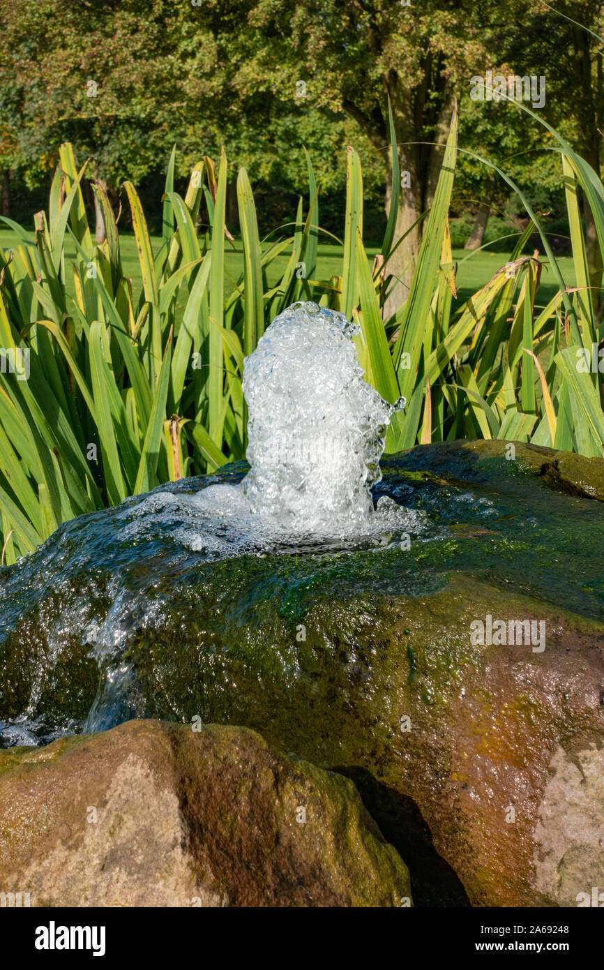 Large natural rock water feature Stock Photo - Alamy
